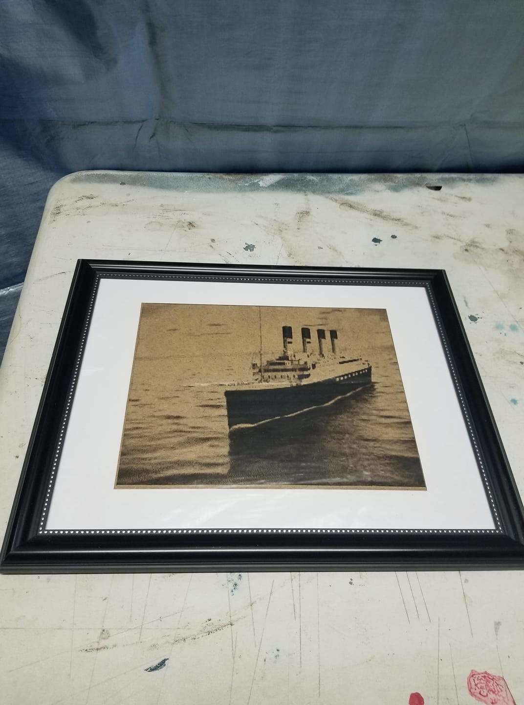 A photo of the Titanic laser engraved into the backing of a picture ...